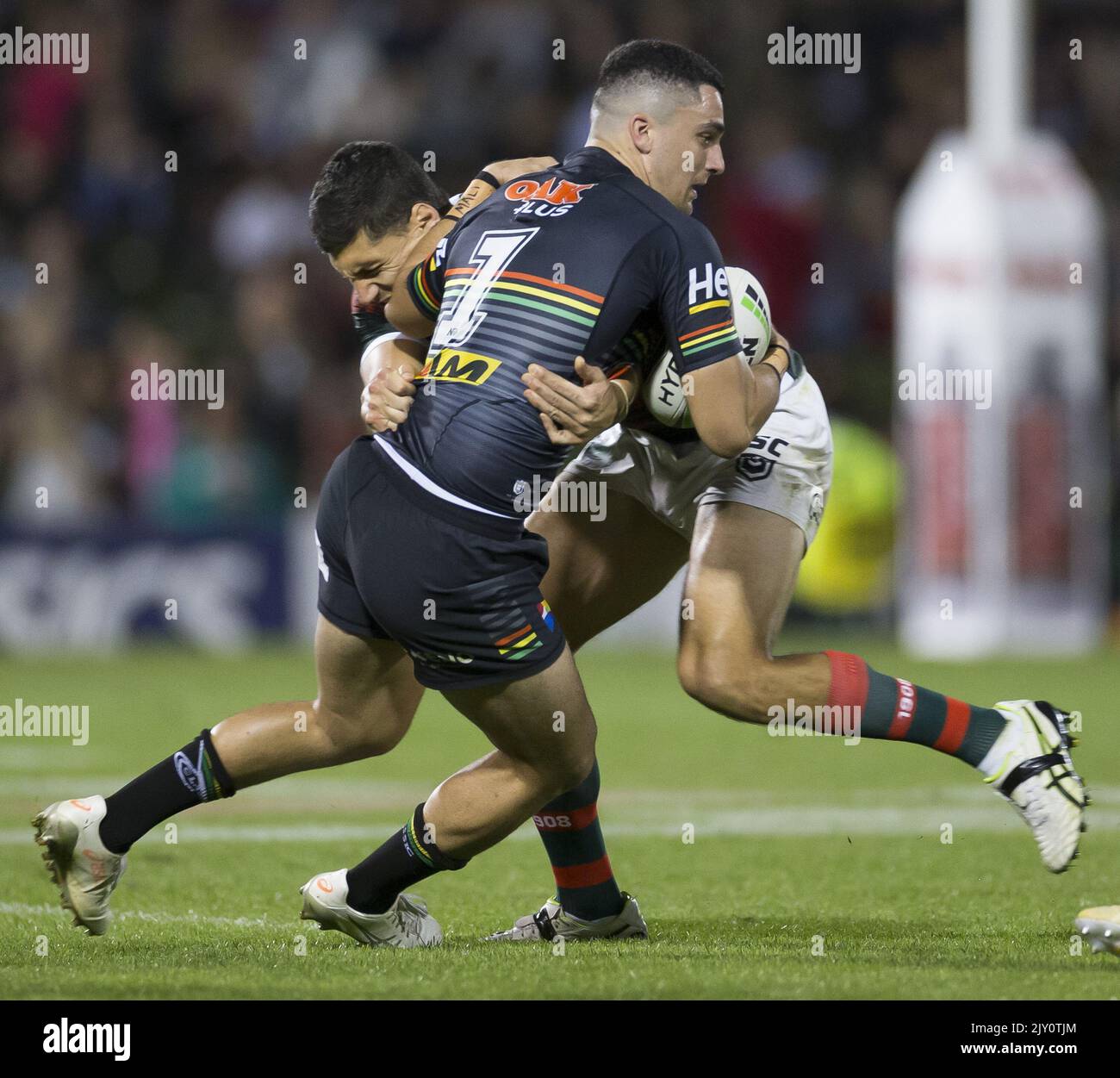 Caleb Aekins of the Panthers is tackled during the Round 7 NRL match ...