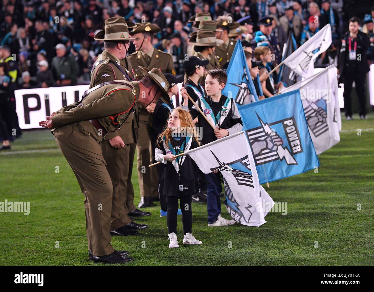 Port Power fans during the Anzac ceremony at the Round 6 AFL match ...