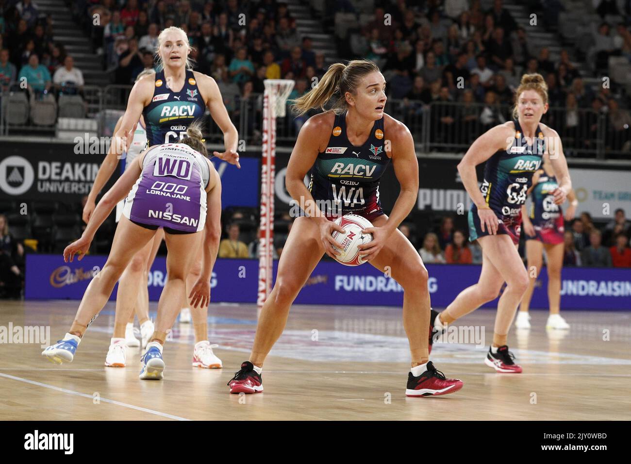 Liz Watson of the Vixens passes the ball during the Round 1 Super ...