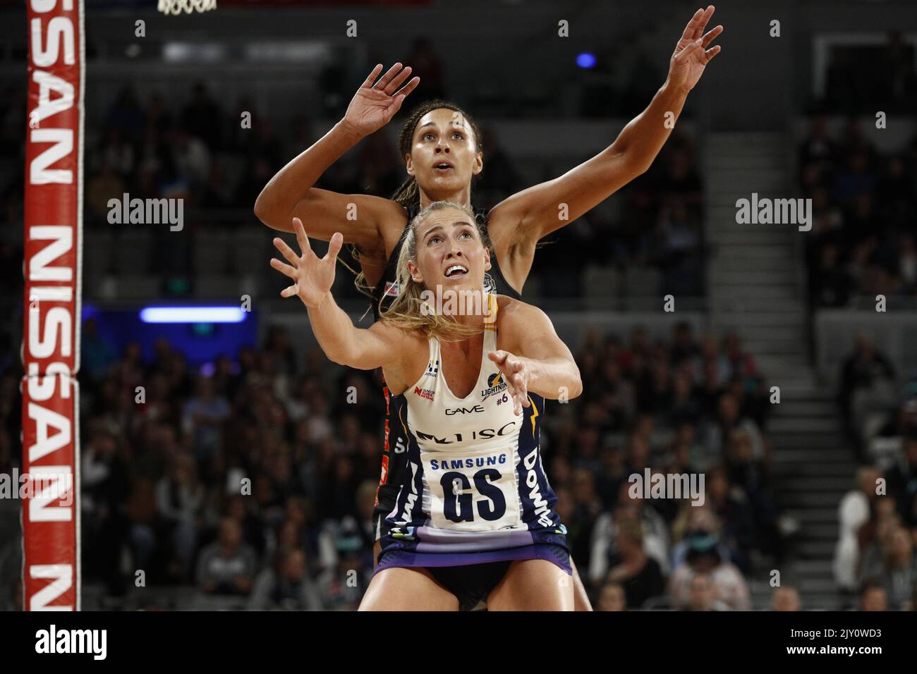 Geva Mentor of the Magpies and Cara Koenen of the Lightning contest the ...