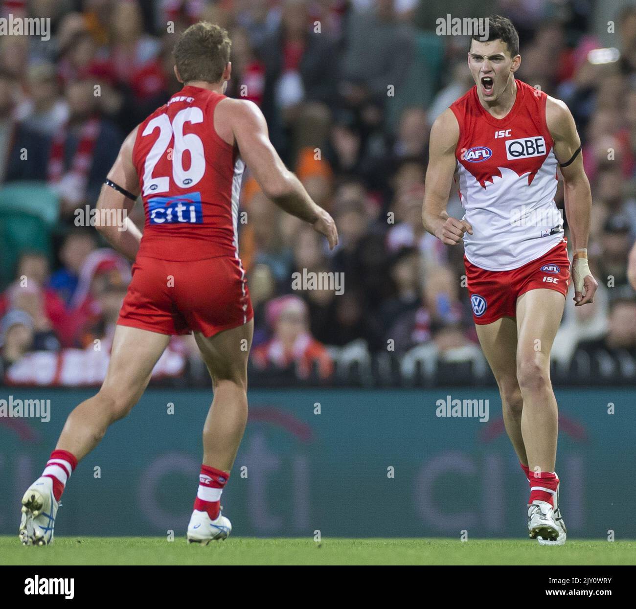 Tom McCartin of the Swans marks then kicks a goal during the Round 6 ...