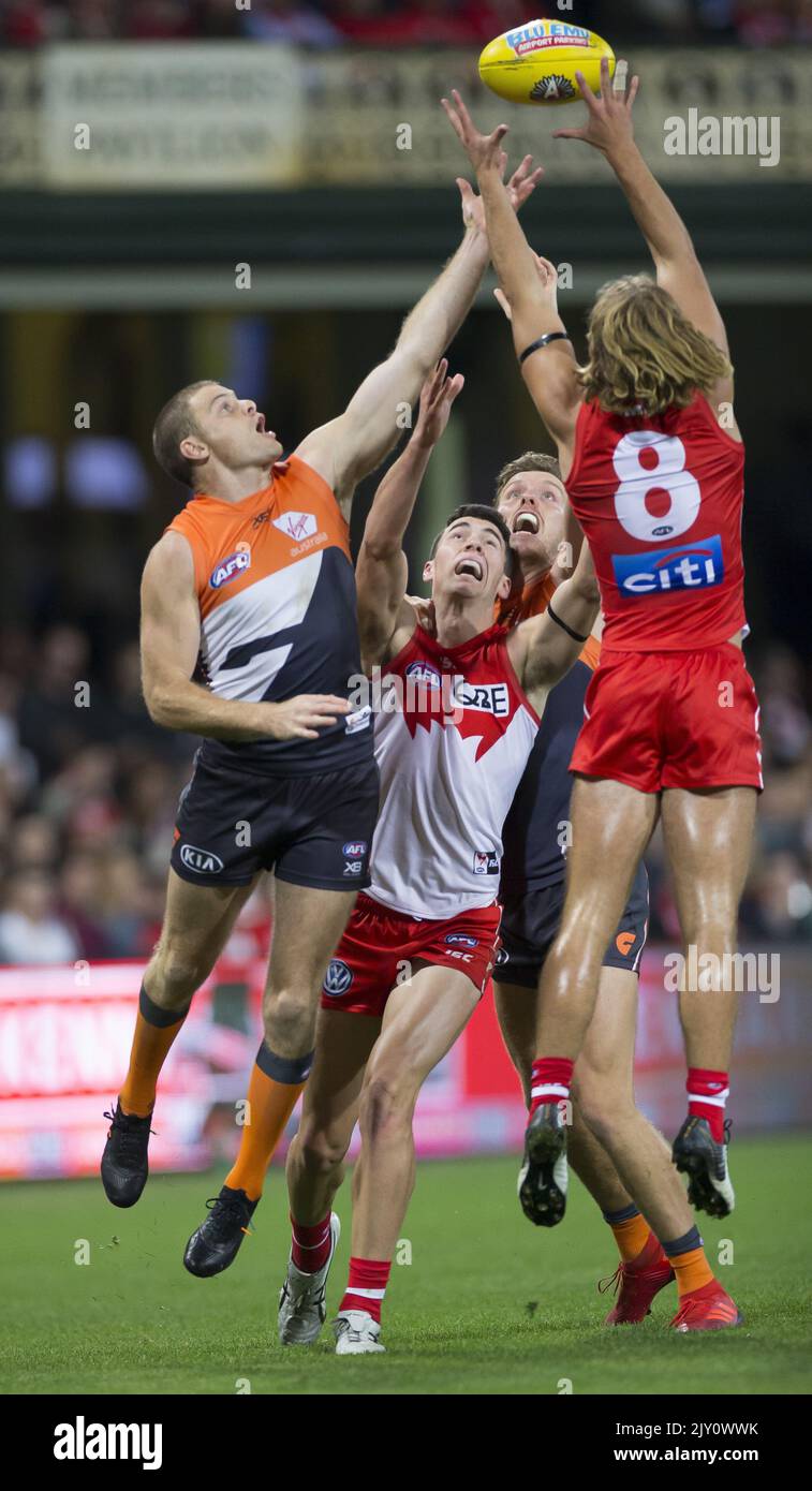Tom McCartin and James Rowbottom of the Swans and Sam J.Reid of the ...