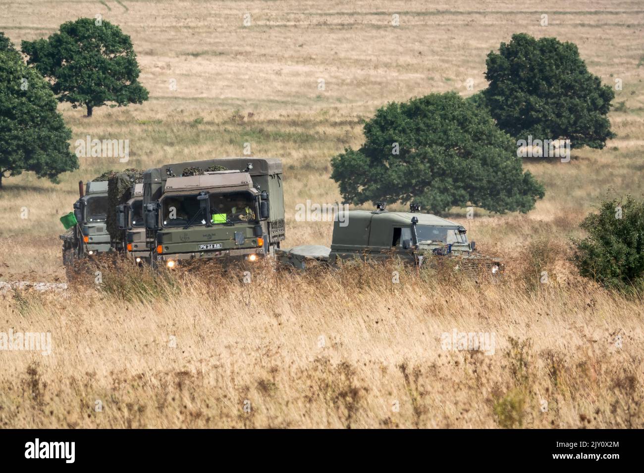 convoy of British army MAN HX60 4x4 & HX58 6x6 Heavy Utility Trucks in ...