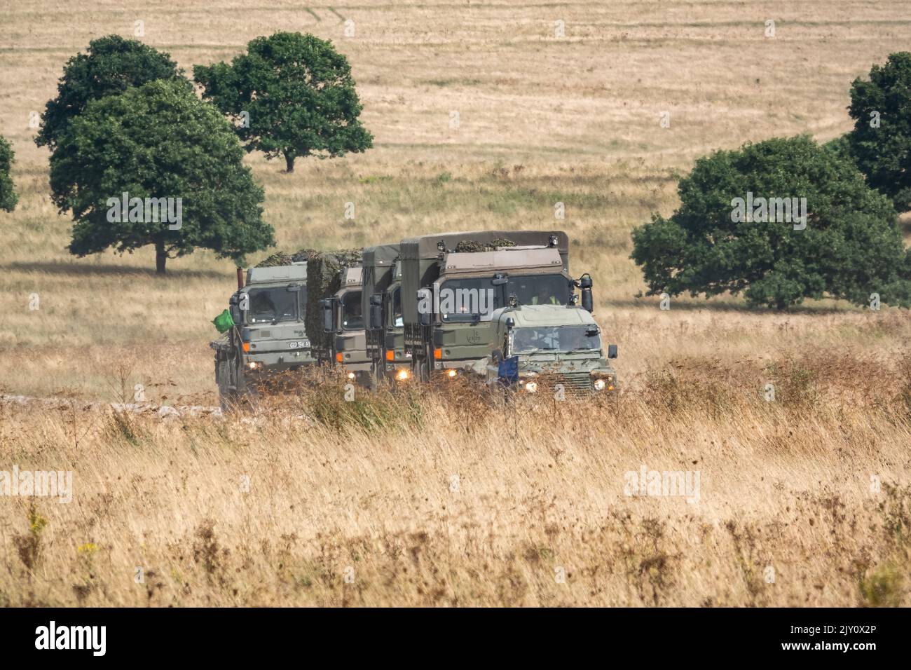 convoy of British army MAN HX60 4x4 & HX58 6x6 Heavy Utility Trucks in ...
