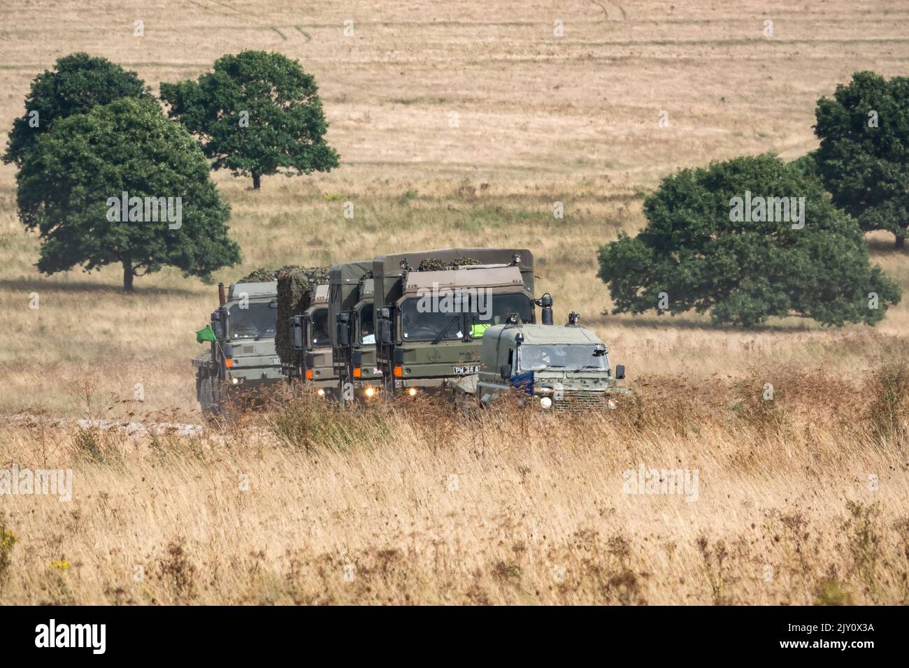 convoy of British army MAN HX60 4x4 and HX58 Heavy Utility Trucks in ...