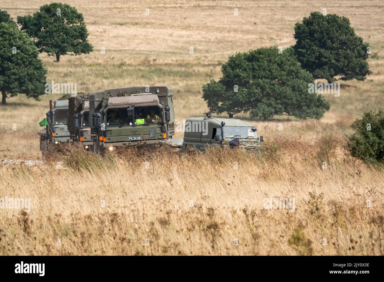 convoy of British army MAN HX60 4x4 and HX58 Heavy Utility Trucks in ...