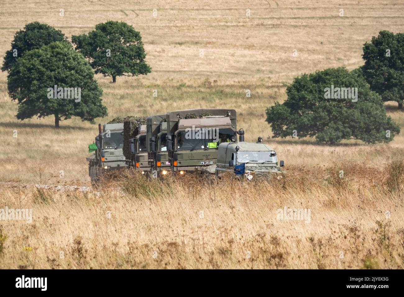 convoy of British army MAN HX60 4x4 & HX58 6x6 Heavy Utility Trucks in ...