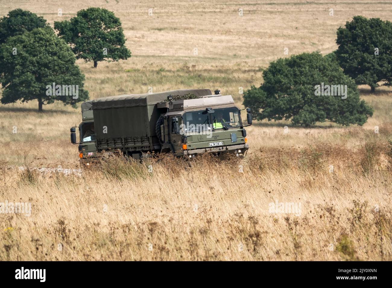 British army MAN HX60 4x4 Heavy Utility Truck in action on a military ...