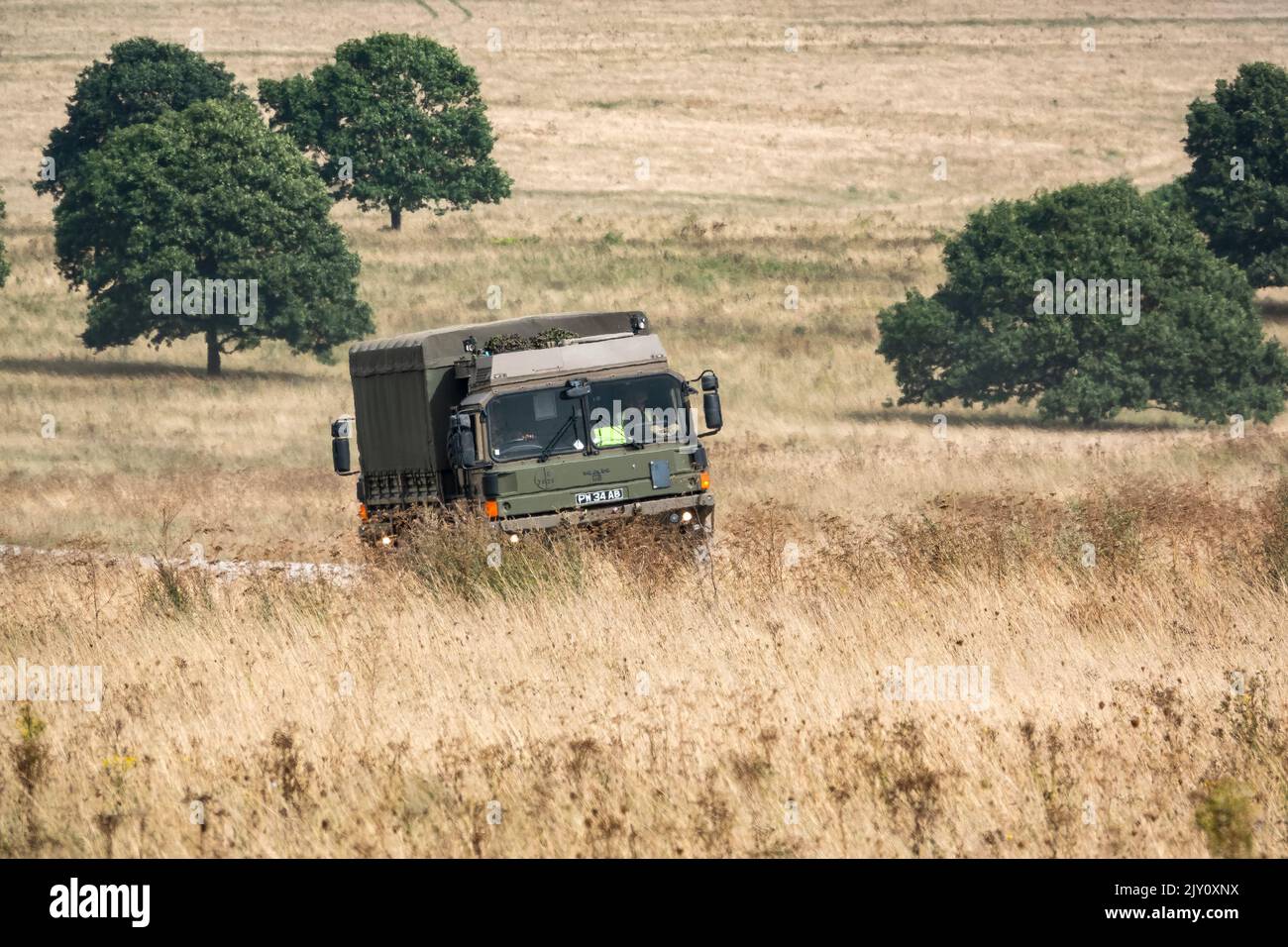 British army MAN HX60 4x4 Heavy Utility Truck in action on a military ...