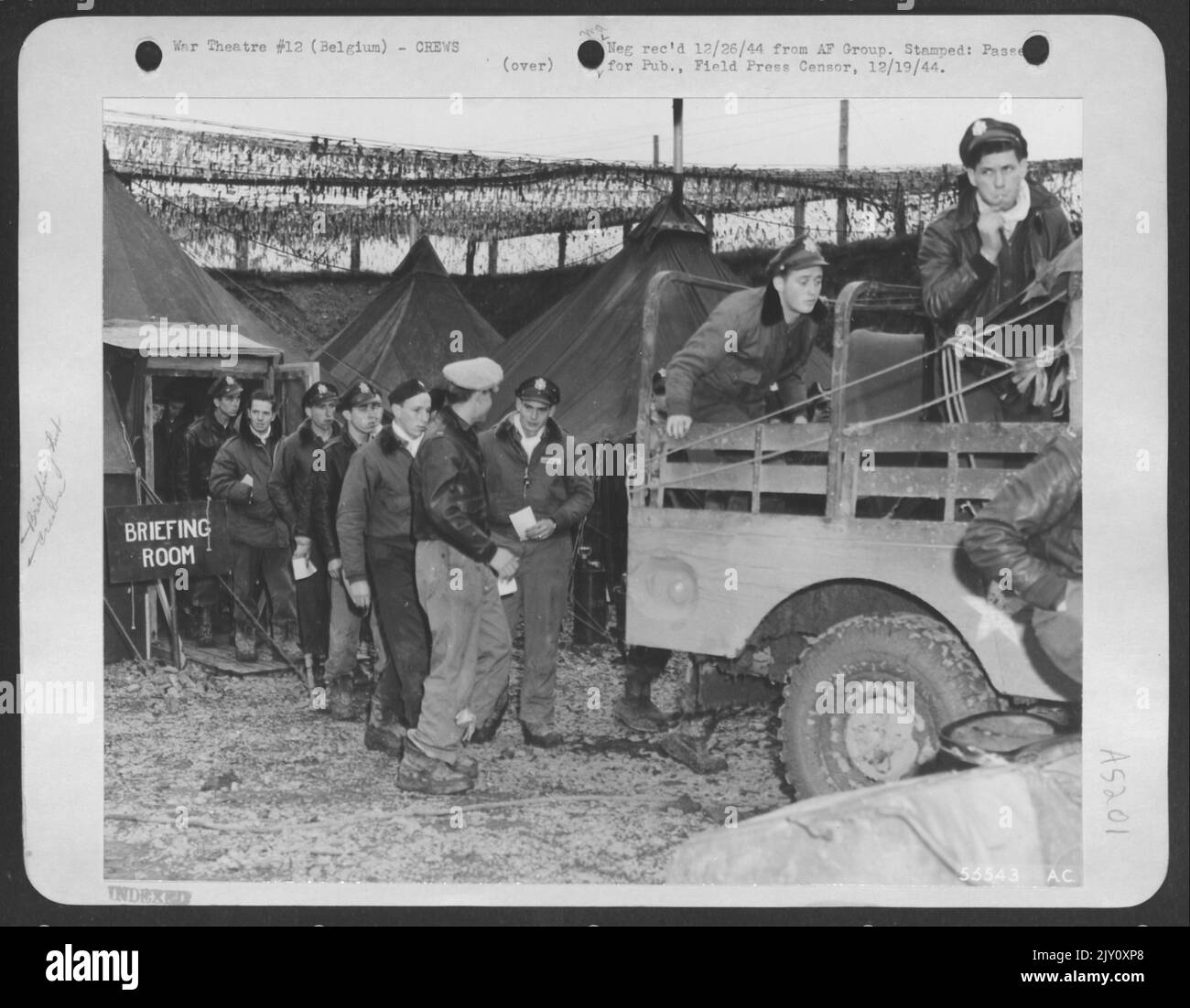 9th Air force P-38 Lightning fighter-bomber pilots leave the briefing ...