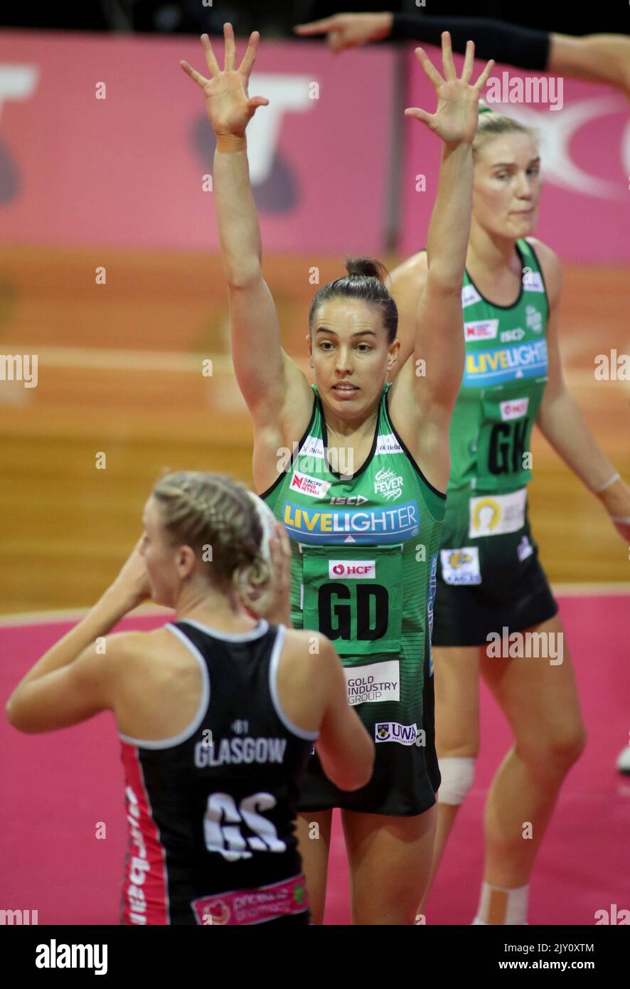 Stacey Francis of the Fever plays defence on Sasha Glagsgow of the ...