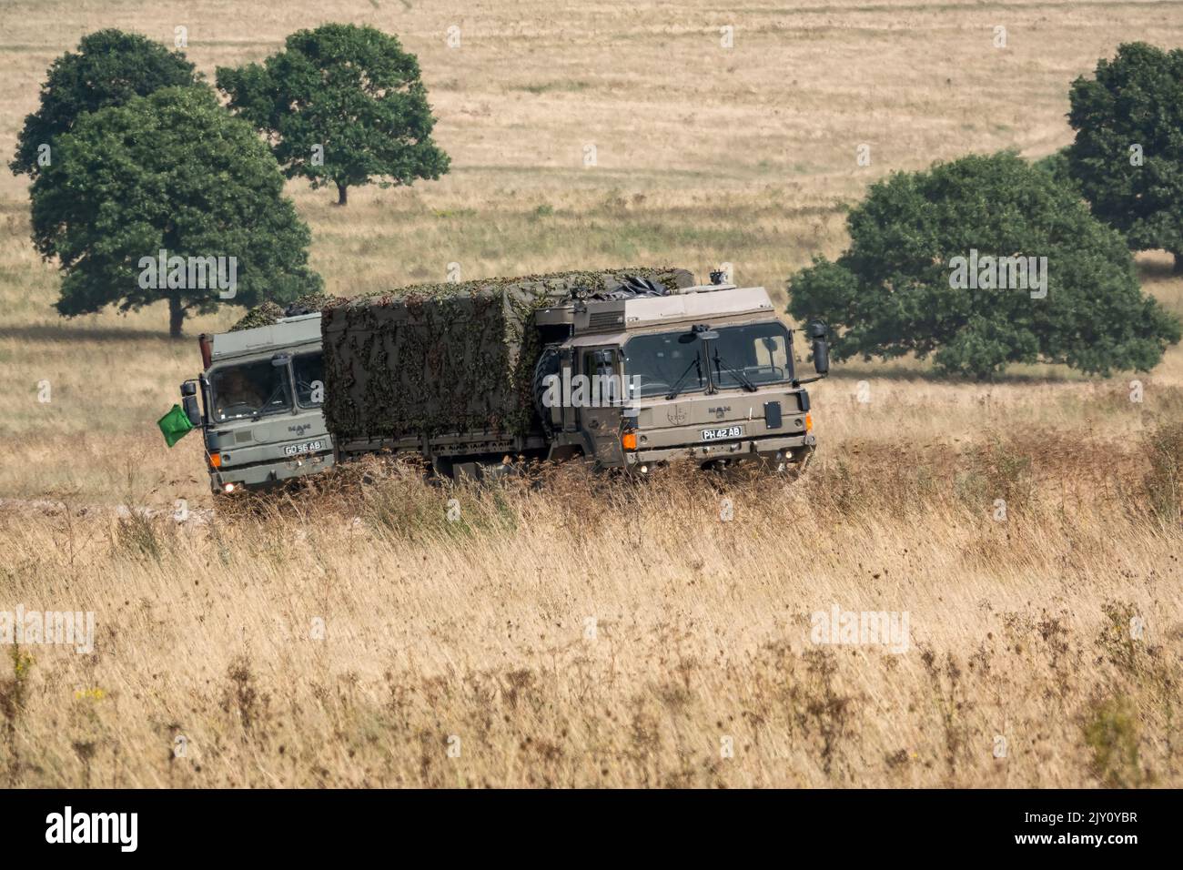 British army MAN HX60 4x4 Heavy Utility Trucks in action on a military ...