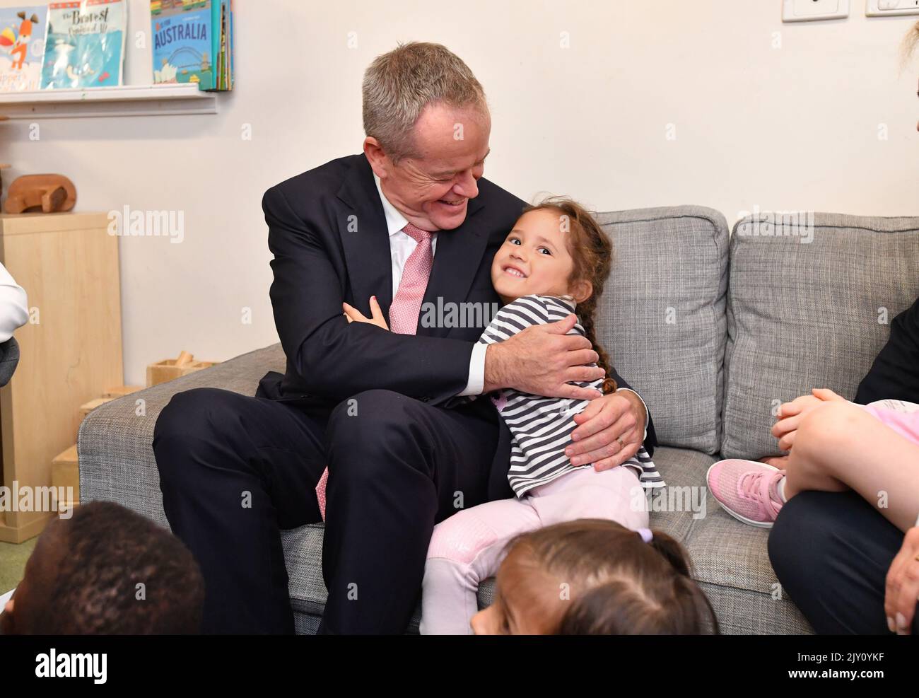 Australian Opposition Leader Bill Shorten (left) is seen getting a hug ...
