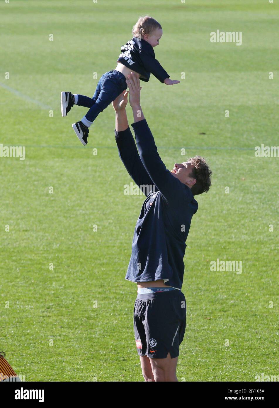Carlton player Ed Curnow is seen with his son Will at the Carlton ...