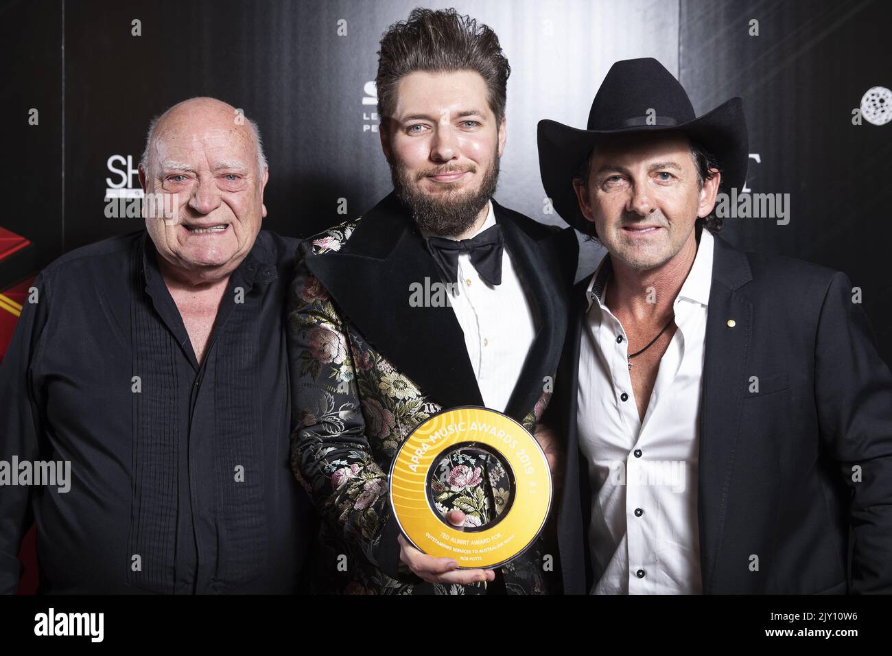 (L-R) Michael Chugg, Jeremy Dylan and Lee Kernaghan pose for a photo ...