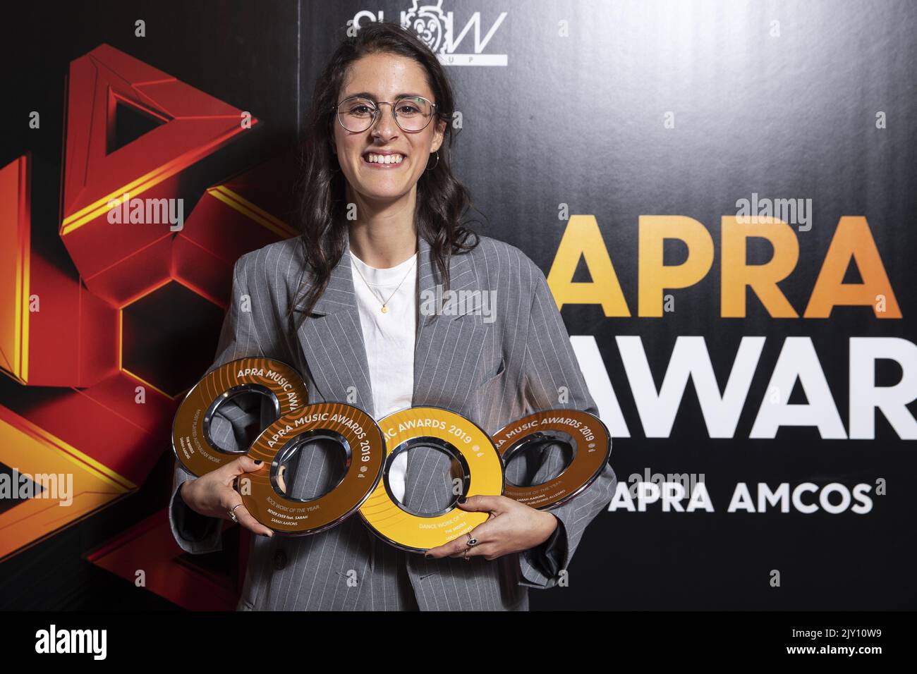 Sarah Aarons poses for a photo with all her awards during the APRA Music Awards in Melbourne ...
