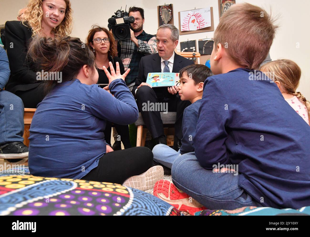 Australian Opposition Leader Bill Shorten (centre) is seen reading to ...