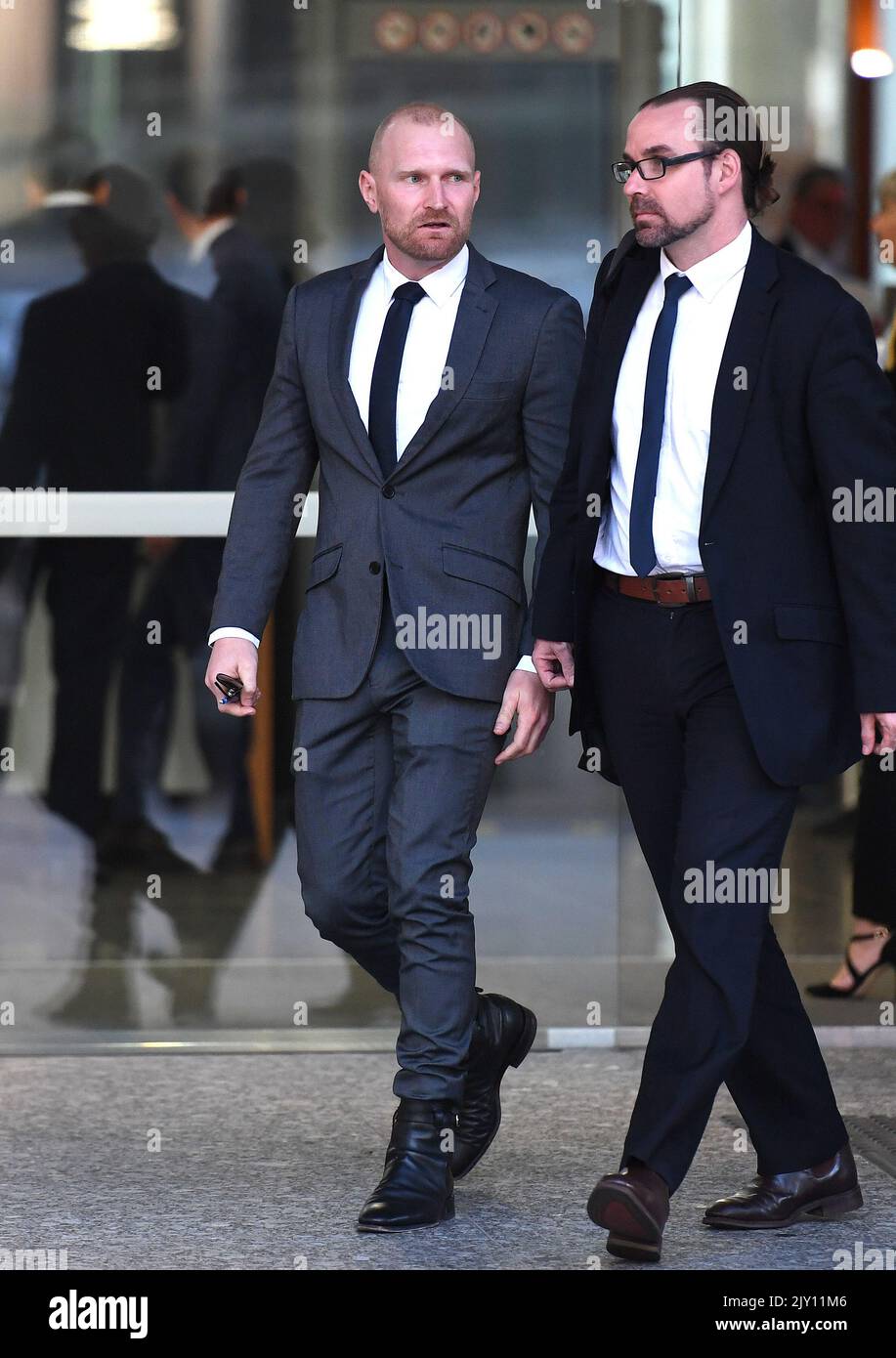 Former Queensland police prosecutor Martin Longhurst (left) leaves the ...