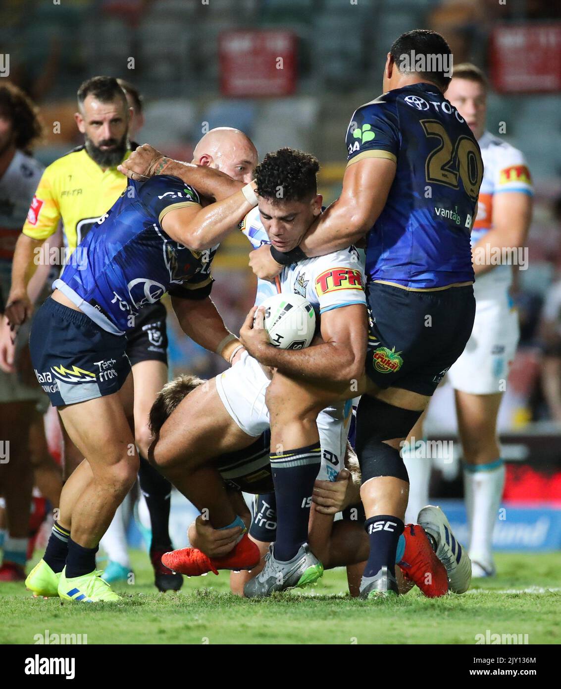 Kevin Proctor of the Titans is wrapped up by Cowboys defence during the ...