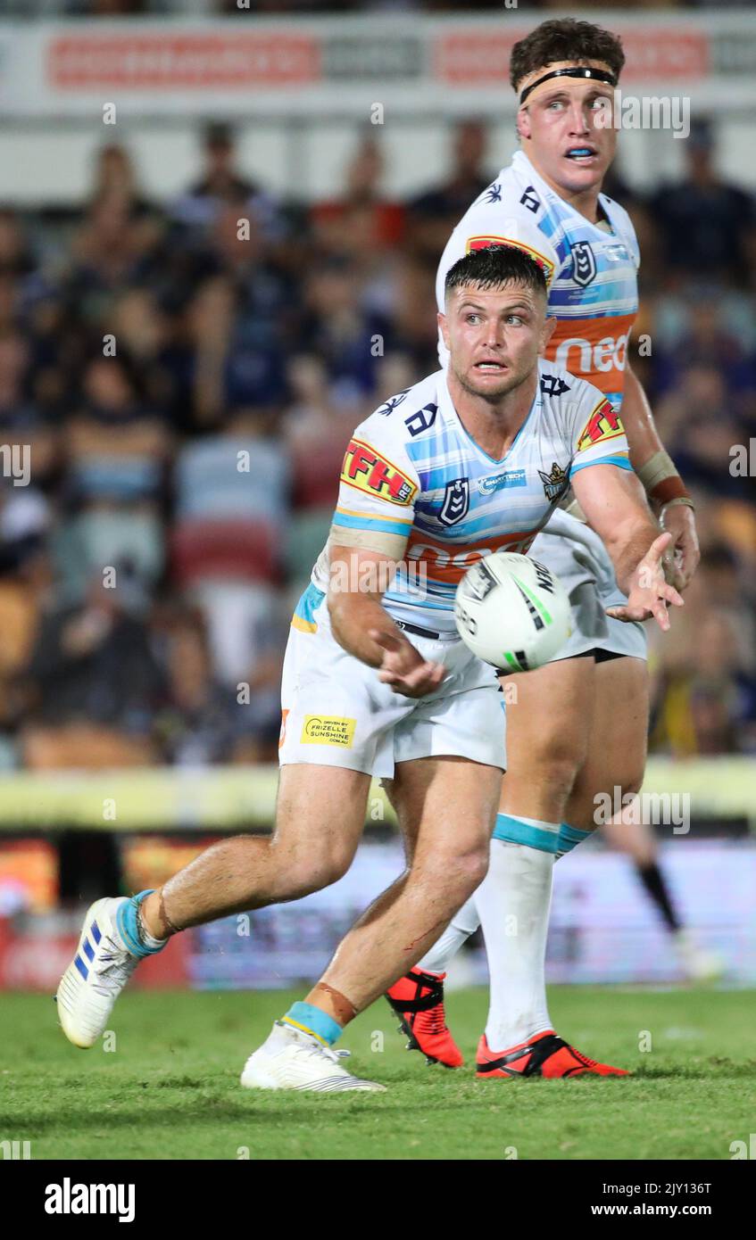 Mitchell Rein of the Titans gets a pass away during the Round 8 NRL ...