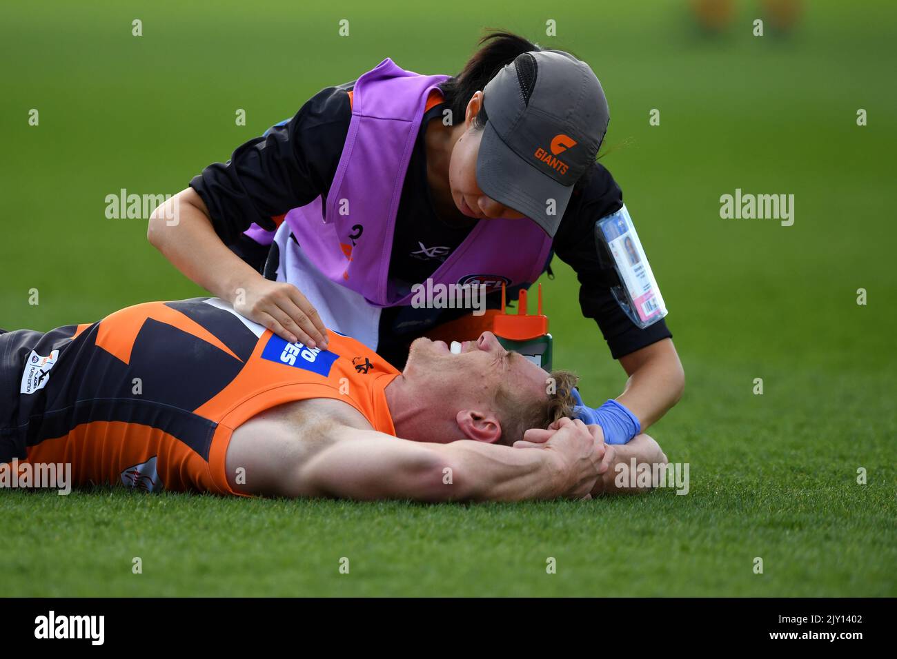 Adam Kennedy of the Giants reacts to a hard knock during the Round 7 ...