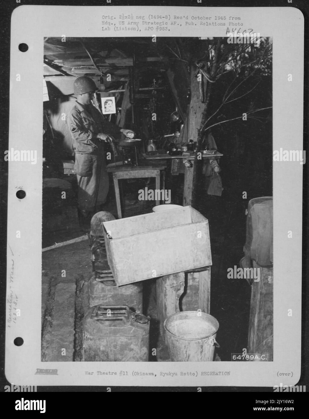 A Member Of The 163Rd Liaison Squadron, 10Th Army, Warming Food Over ...