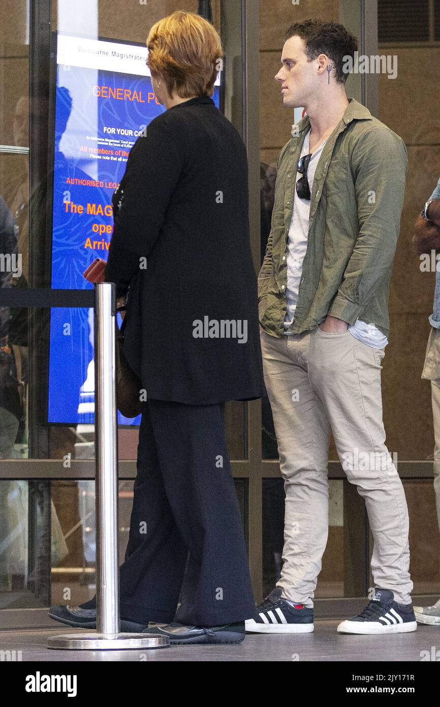 Joshua Burke (right) arrives at the Melbourne Magistrates Court in ...