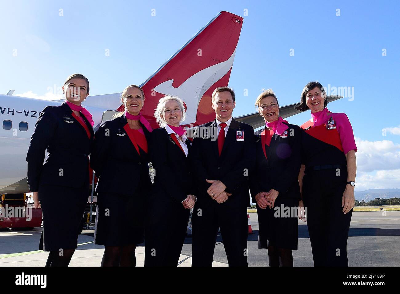 Qantas cabin crew members pose for a photograph at Adelaide Airport in ...
