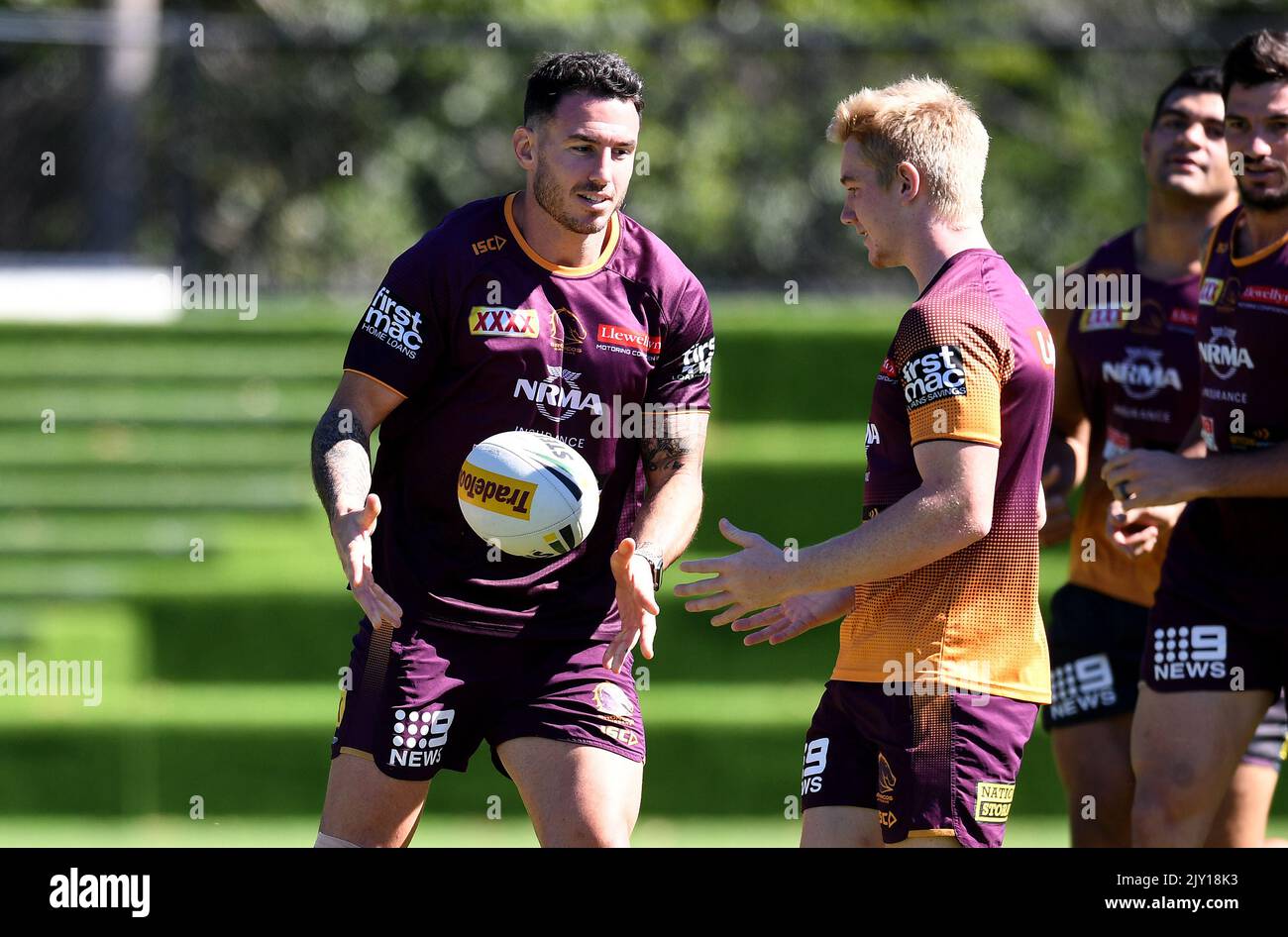 Brisbane Broncos captain Darius Boyd (left) and teammate Tom Dearden ...