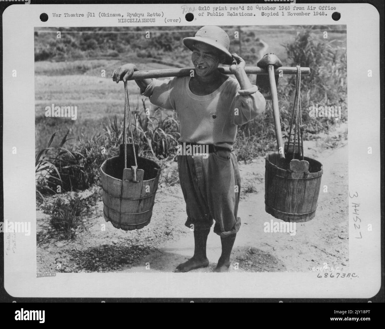 Native Farmer Tips Sun Helmet In American Fashion - A Toothy Smile Is ...