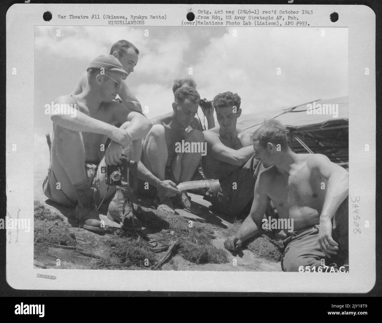 Engineers Of The 807Th Engineer Aviation Battalion Examine A Piece Of ...
