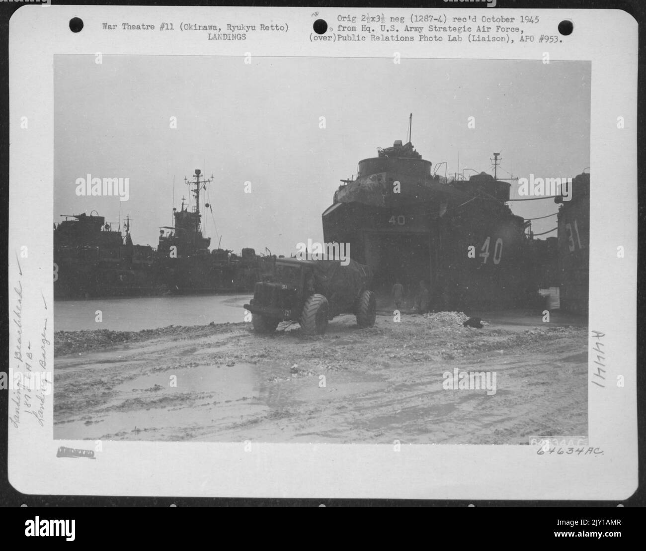 Heavy Equipment Rolls Off One Of The Lst (Landing Ship Tanks) During ...