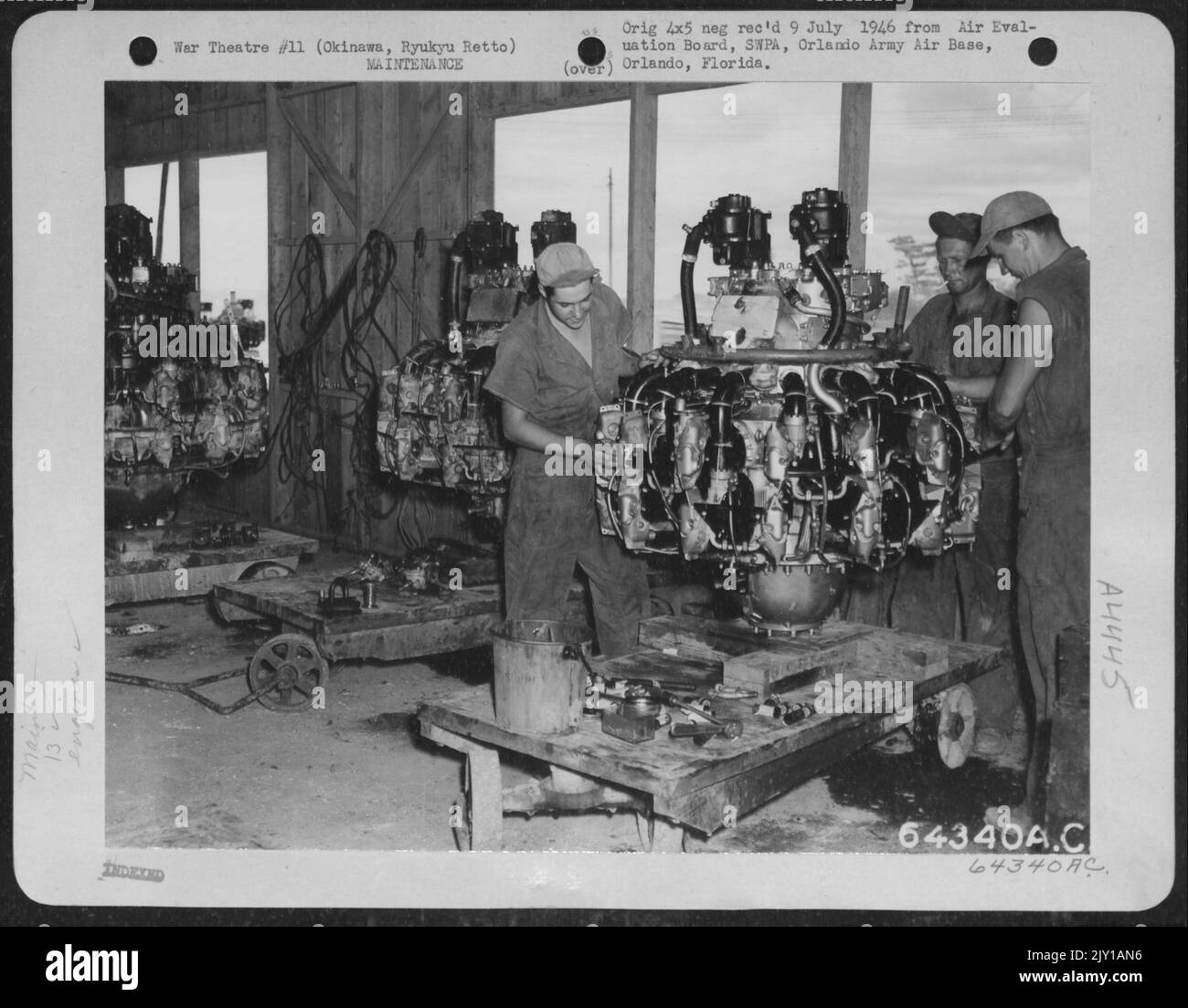 In The Engine 'Build-Up' Shop On Yontan Airstrip, Mechanics Of The 13Th ...