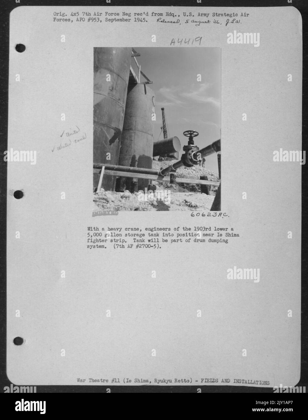 With A Heavy Crane, Engineers Of The 1903Rd Lower A 5,000 Gallon ...