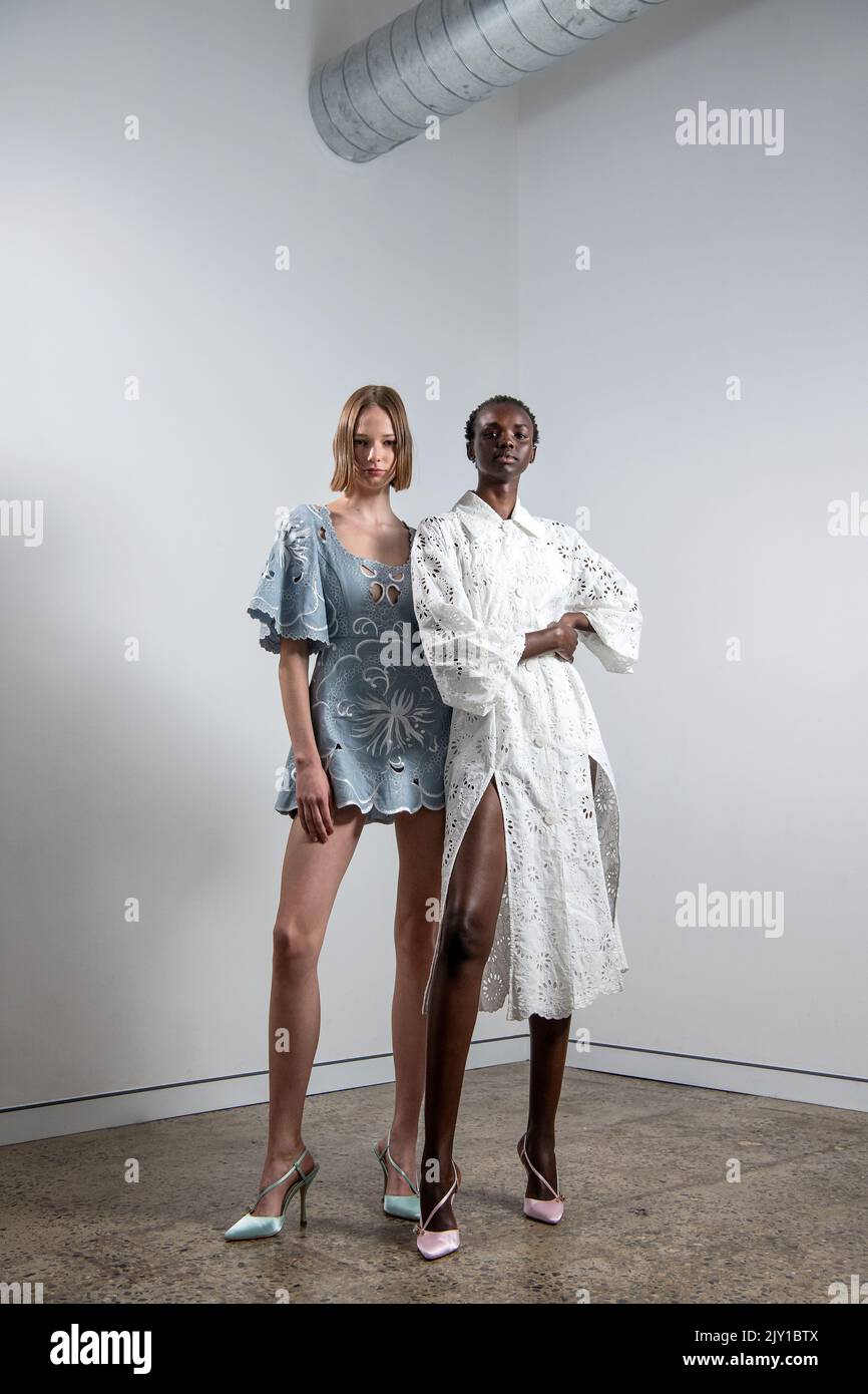 Models Eva Varlamova and Akiima (right) pose for a photograph wearing a ...