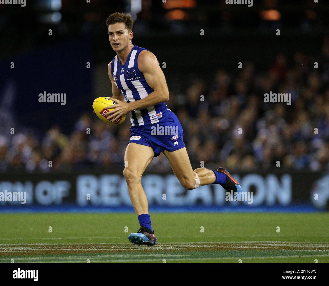 Shaun Atley of the Kangaroos runs forward during the Round 8 AFL match ...