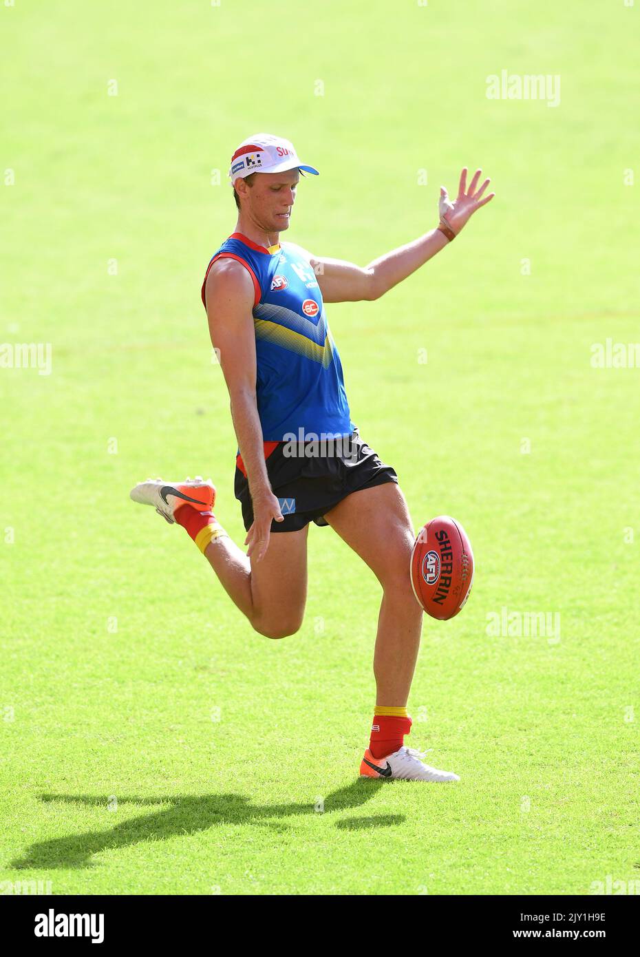 Jack Lukosius kicks during the Gold Coast Suns training session at ...