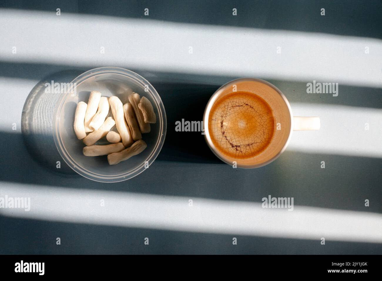 bowl of salty snack with empty cup of coffee Stock Photo - Alamy