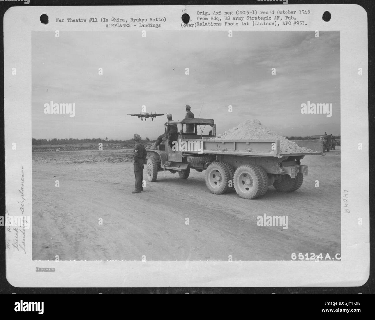 Atop A Coral Truck, Members Of An Engineer Aviation Battalion Watch ...