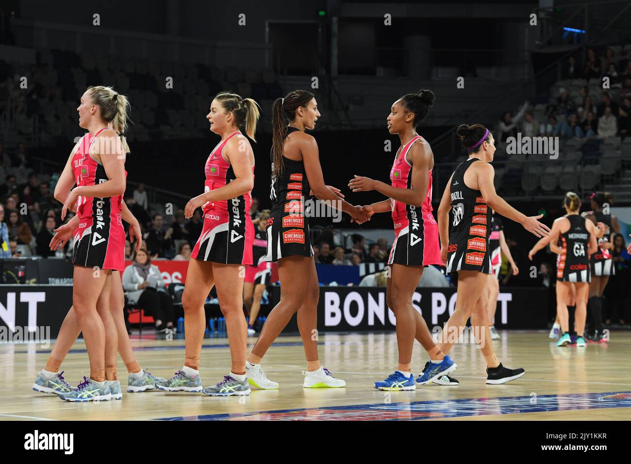 Magpies and Thunderbird players shake hands at the conclusion of the ...