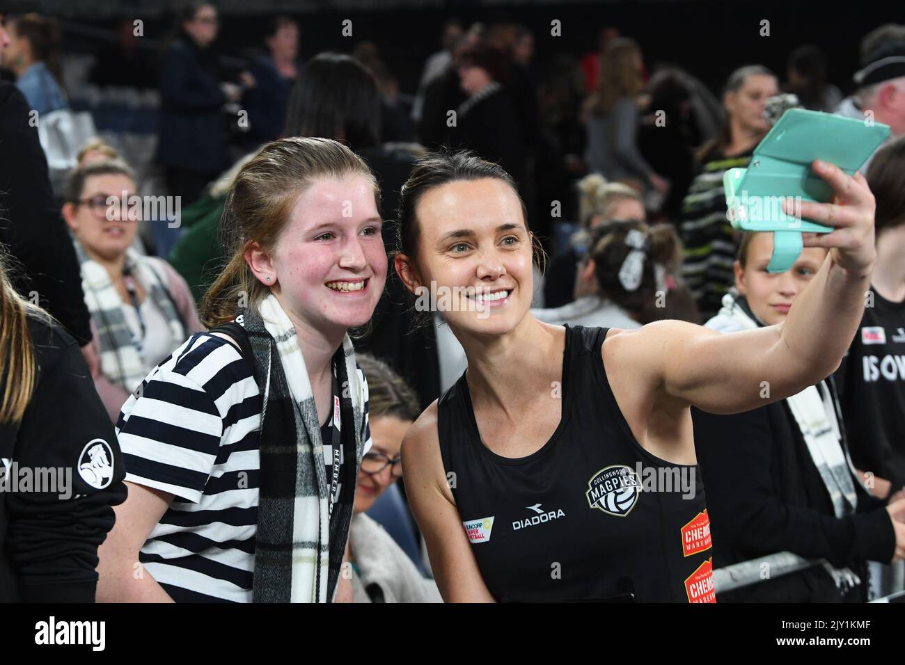 Natalie Medhurst of the Magpies takes a selfie with a fan following the ...