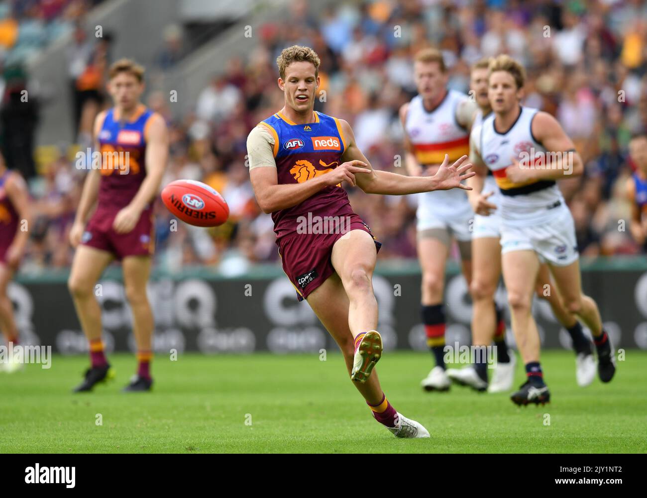 Mitchell Hinge (centre) of the Lions in action during the Round 9 AFL ...