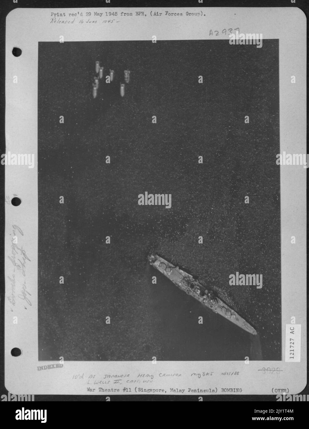 A Cluster Of Bombs From A B-29 Superfortress Falls Toward A Damaged ...