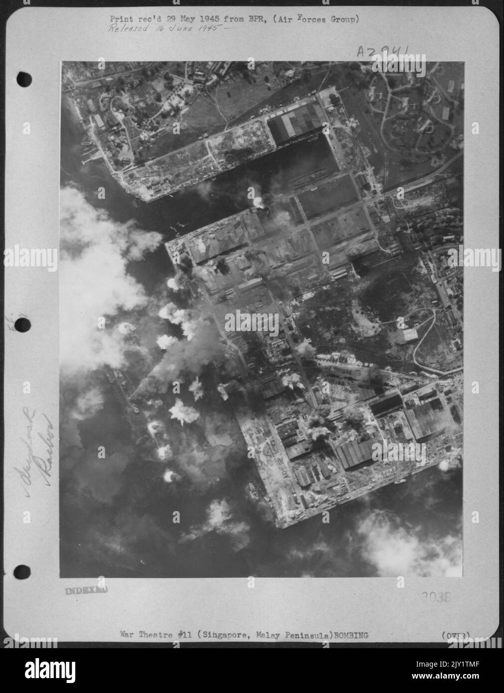 Bombs From A B-29 Superfortresses Plaster The Singapore Naval Vessel ...