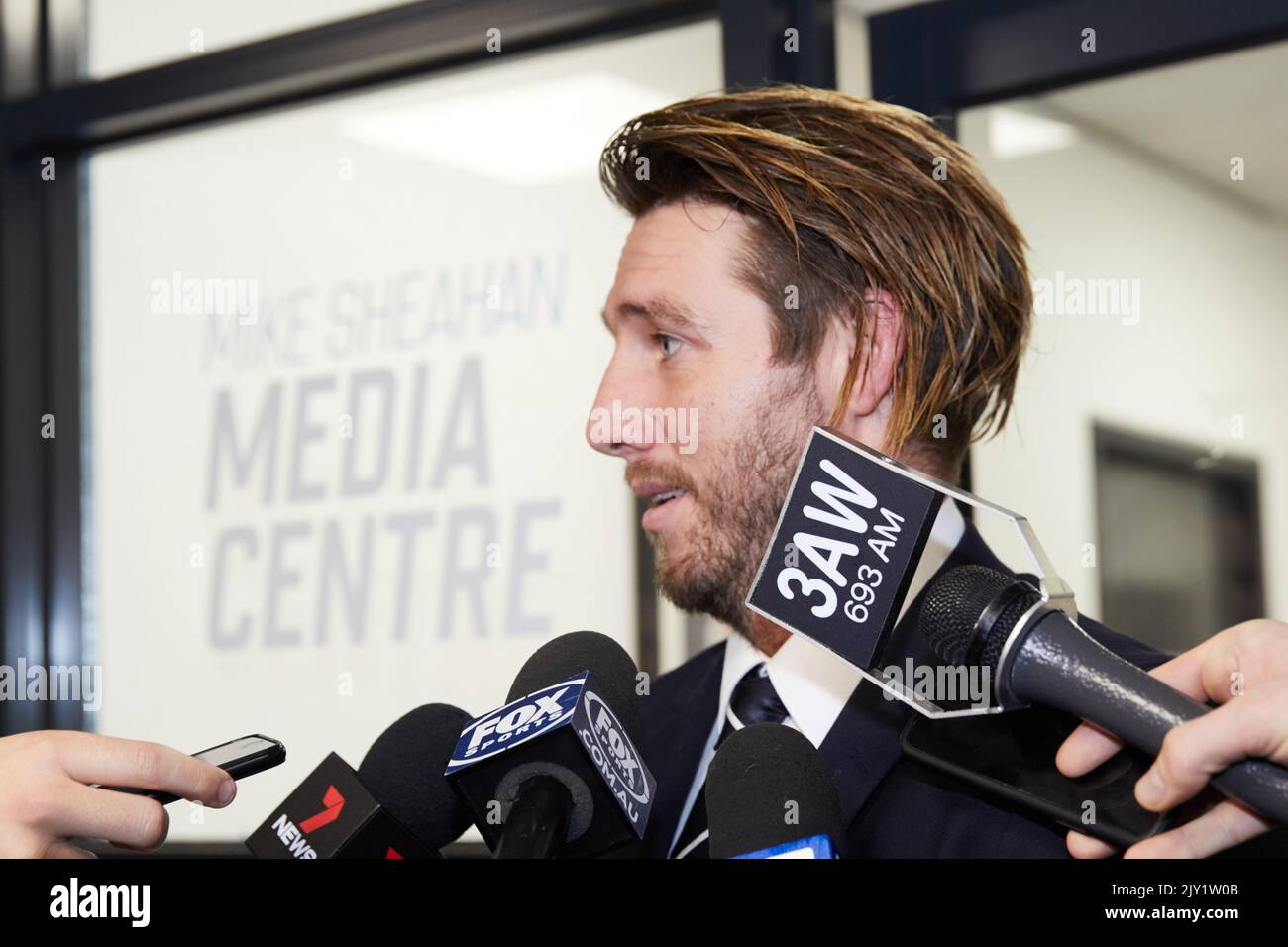 Carlton Blues player Dale Thomas speaks to the media while leaving the ...