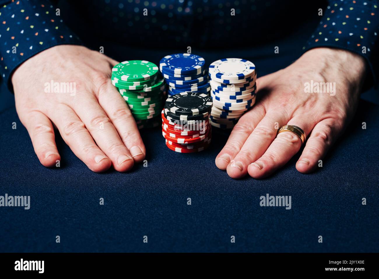 Man betting all his chips by going all in Stock Photo - Alamy