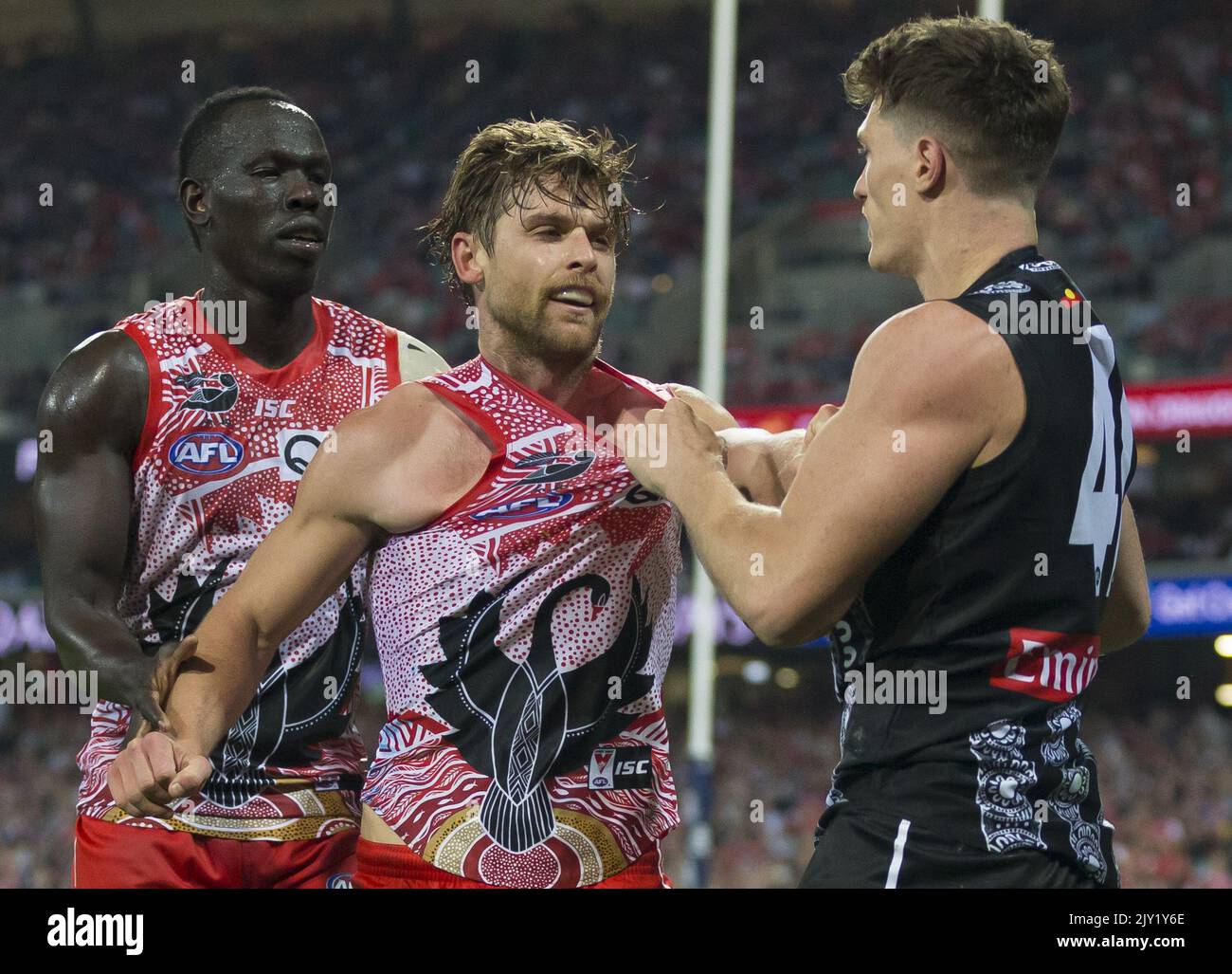 Dane Rampe of the Swans and Brody Mihocek of the Magpies during the ...