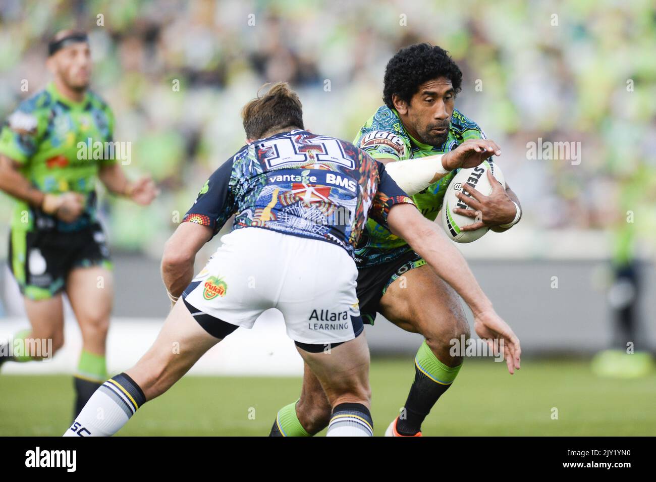 Sia Soliola of the Raiders looks for a way around Gavin Cooper of the ...