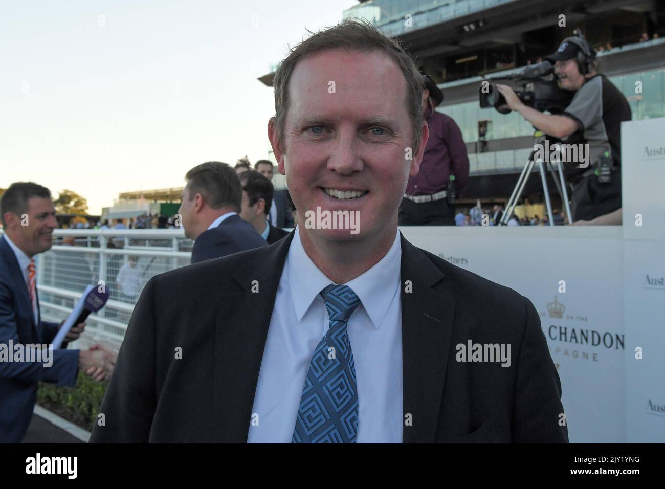 Trainer Michael Hawkes is seen in the mounting yard after Renewal wins ...