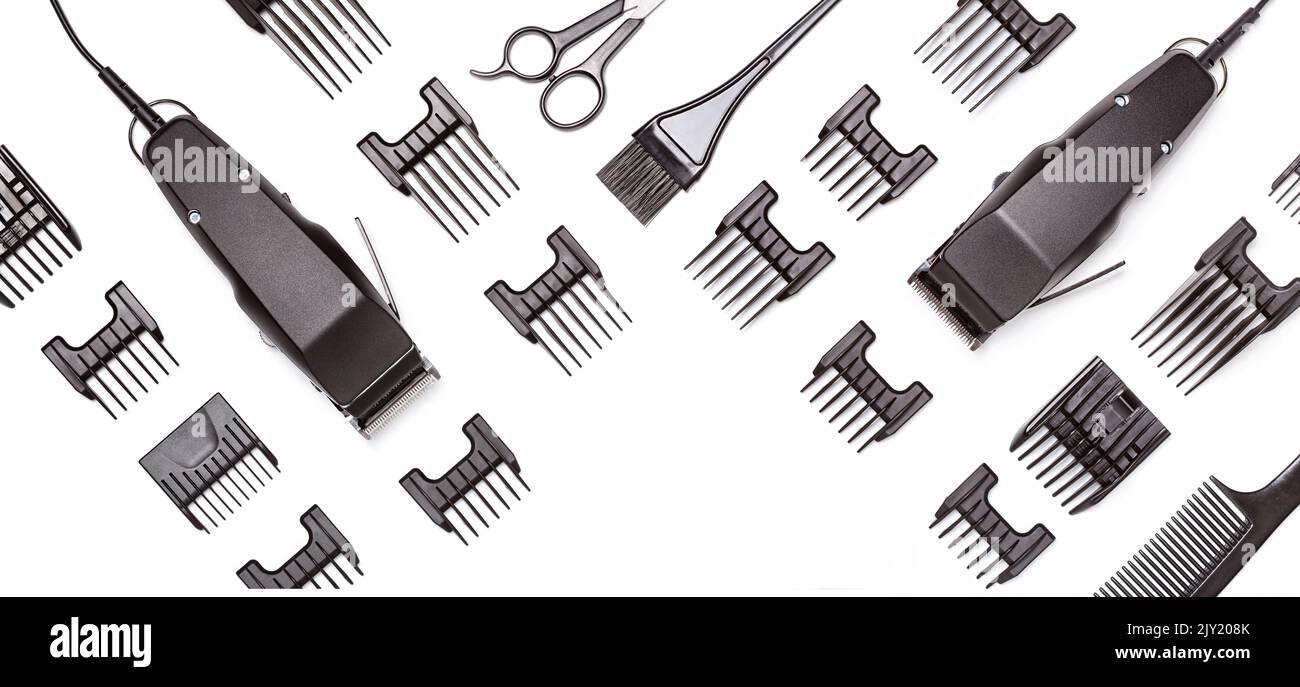 Professional hair clippers with set of nozzles of different sizes ...